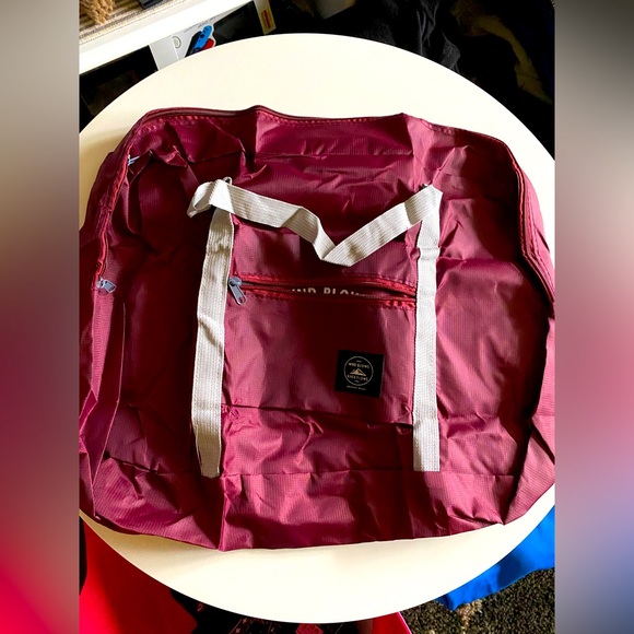 Created by Travel | Bags | Wind Blows River Flows Created By Travel Maroon Packable Duffle Bag ...